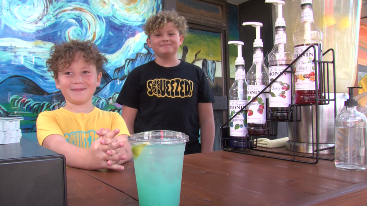Three siblings squeezing the day behind lemonade stand | CHAT News Today
