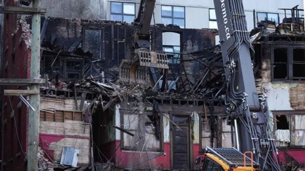 Two bodies found during demolition of fire-ravaged building in ...