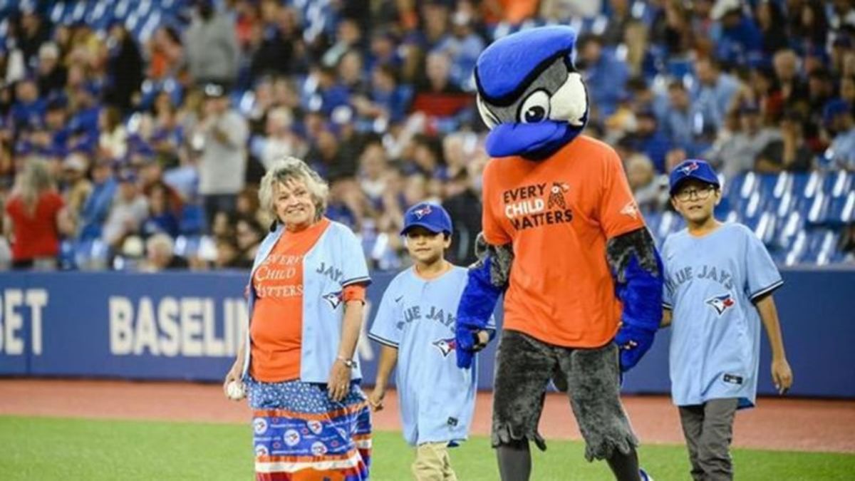 Residential school survivor throws first pitch at Jays game for Orange ...