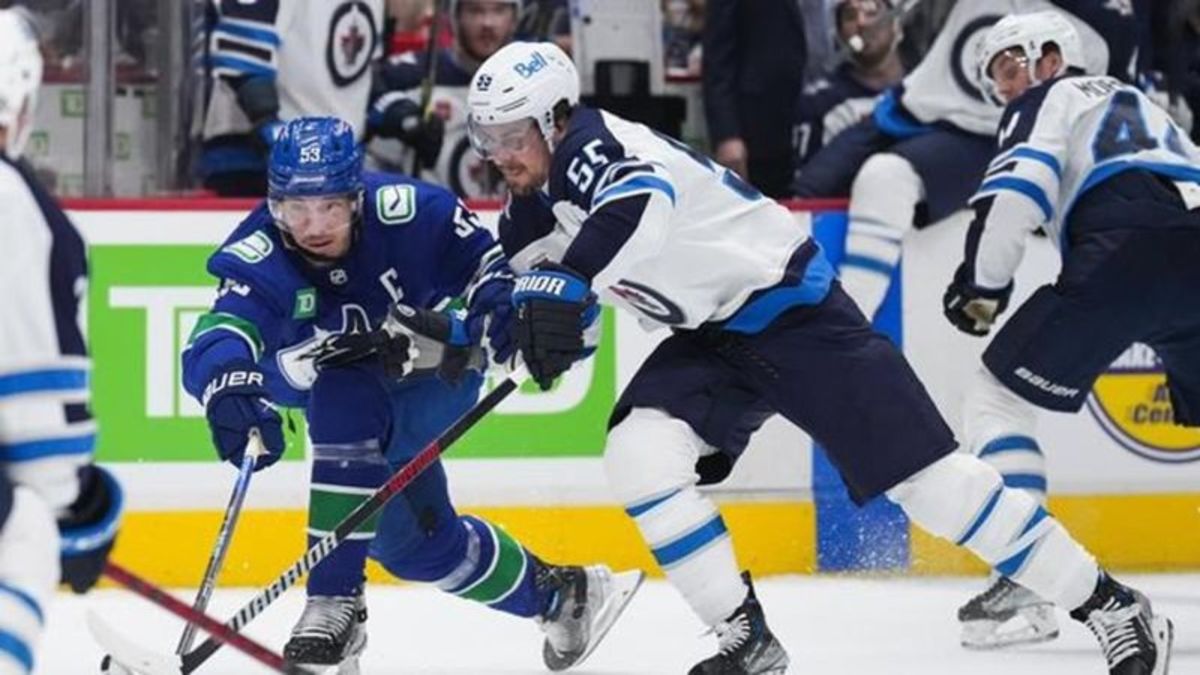 Connor extends streak, Winnipeg Jets hand Vancouver Canucks lopsided ...