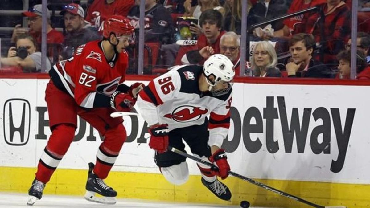 Jesper Fast scores on OT deflection, Hurricanes eliminate Devils in ...