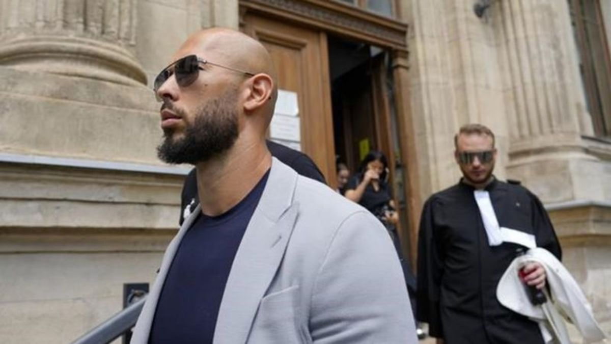 Influencer Andrew Tate released from house arrest while he awaits human trafficking and rape ...